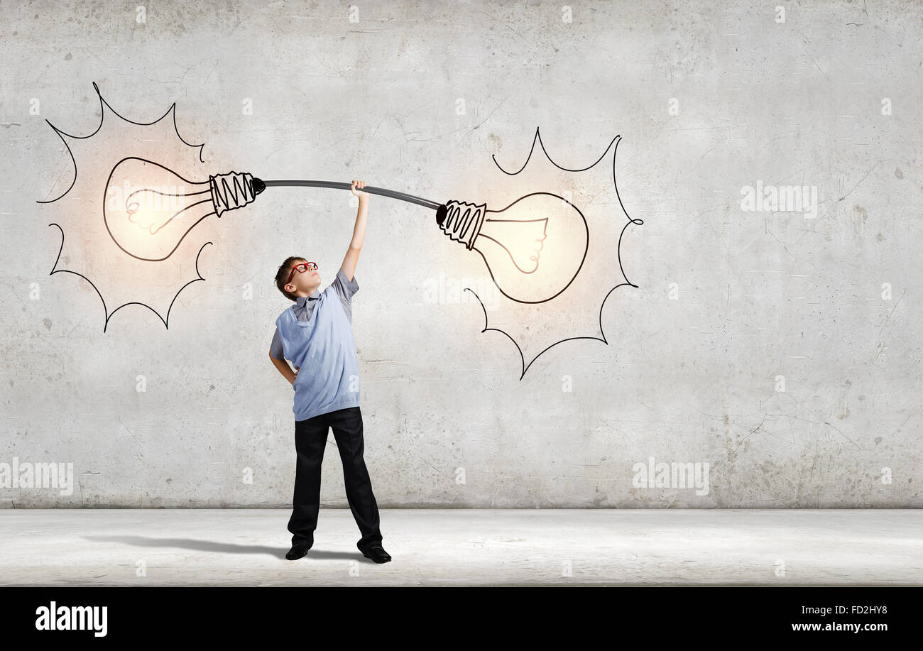 Boy of school age lifting barbell on one hand Stock Photo - Alamy