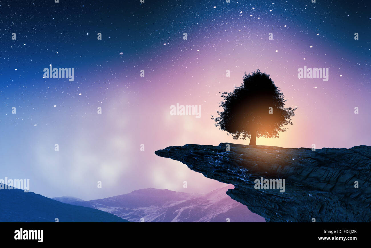 Natural scene with silhouette of tree against sunset light Stock Photo ...