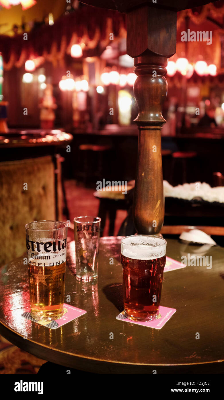 Pint of Estrella Lager and pint of real ale in a pub Stock Photo - Alamy