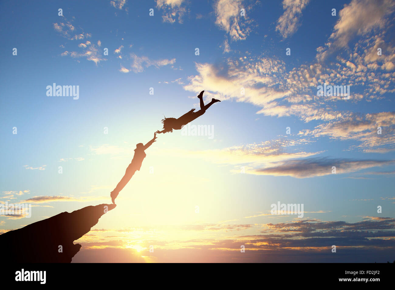 Two young business people flying in sky Stock Photo - Alamy