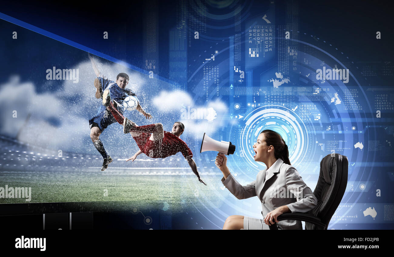 Emotional woman watching football match on 3 d tv Stock Photo - Alamy