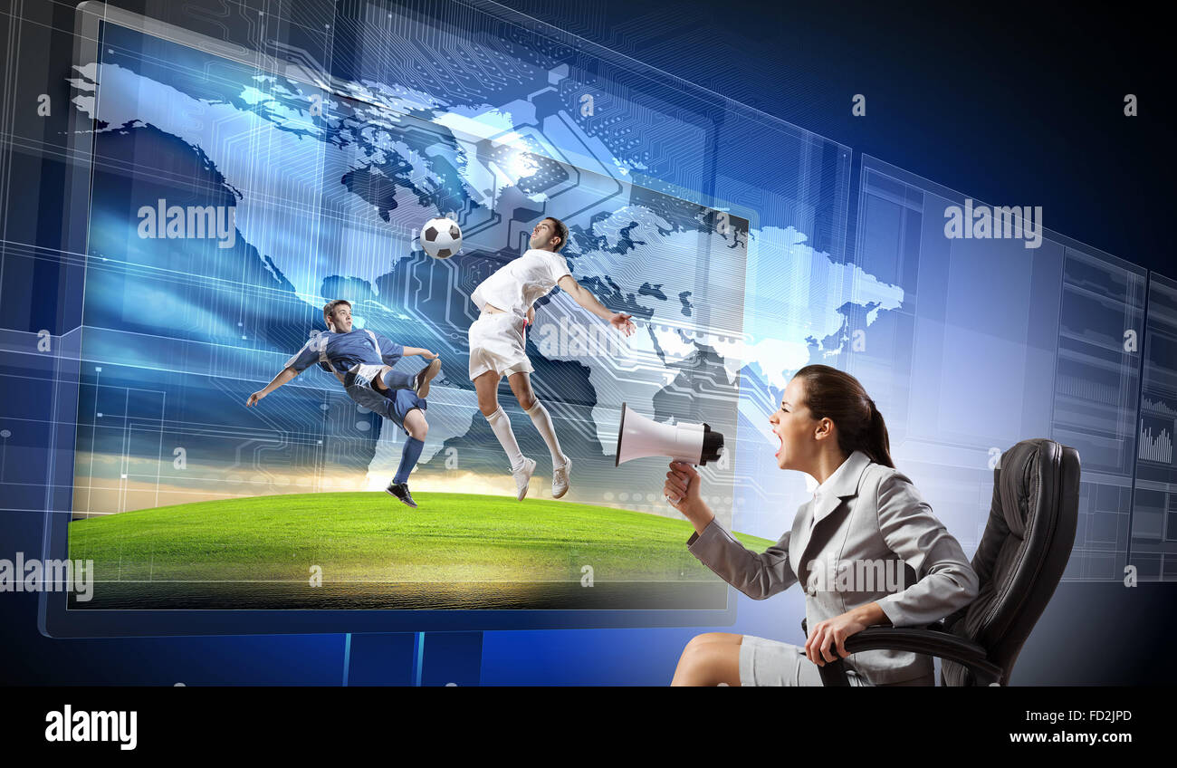 Emotional woman watching football match on 3 d tv Stock Photo - Alamy