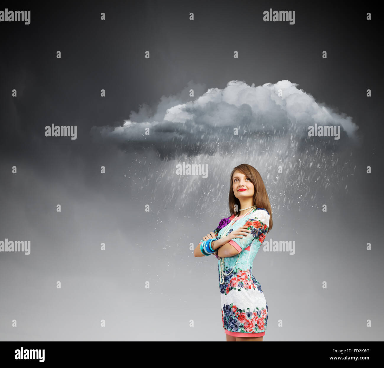 Girl standing under cloud rain hi-res stock photography and images - Alamy