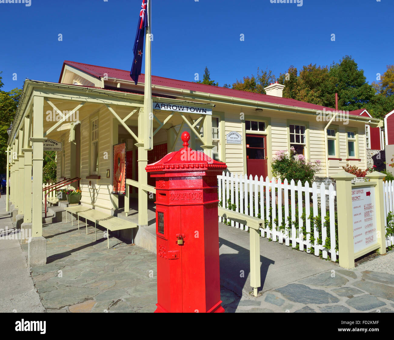A red letter box in front The Old Post Office in the Main street Arrow ...
