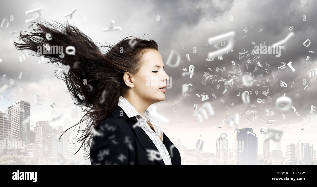 Young businesswoman with closed eyes and wind blowing in her face Stock ...