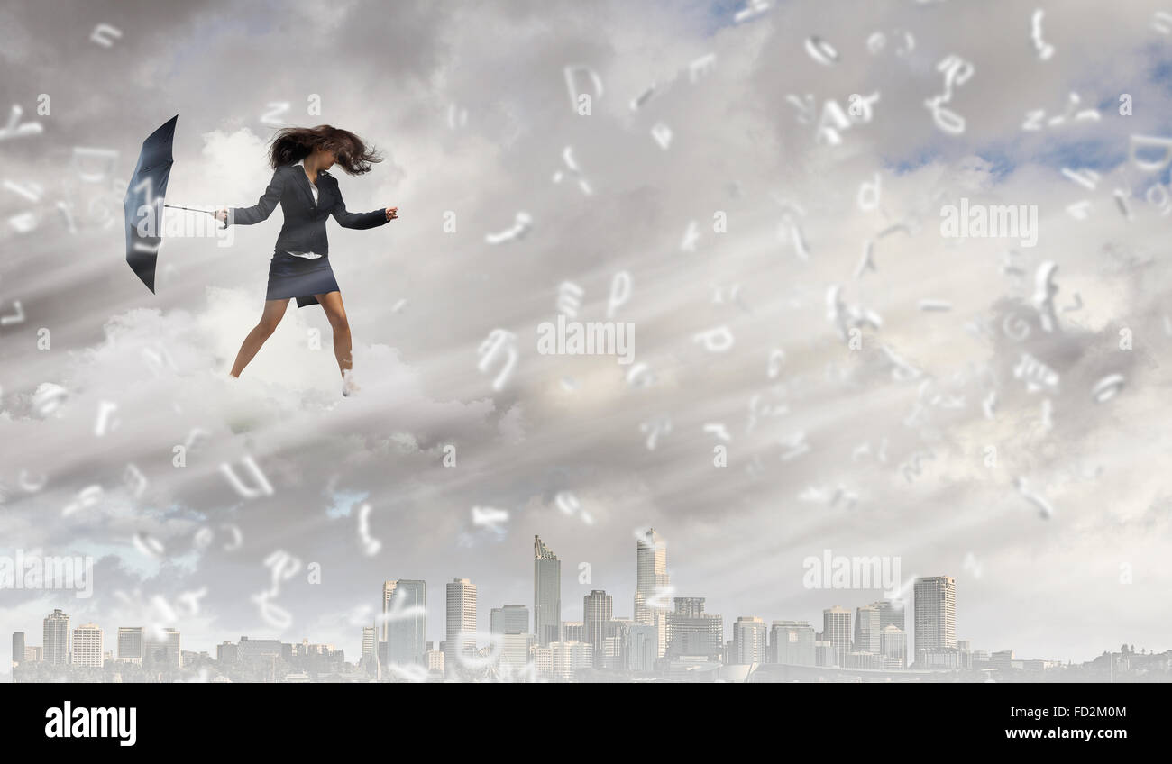 Person holding umbrella against wind hi-res stock photography and ...