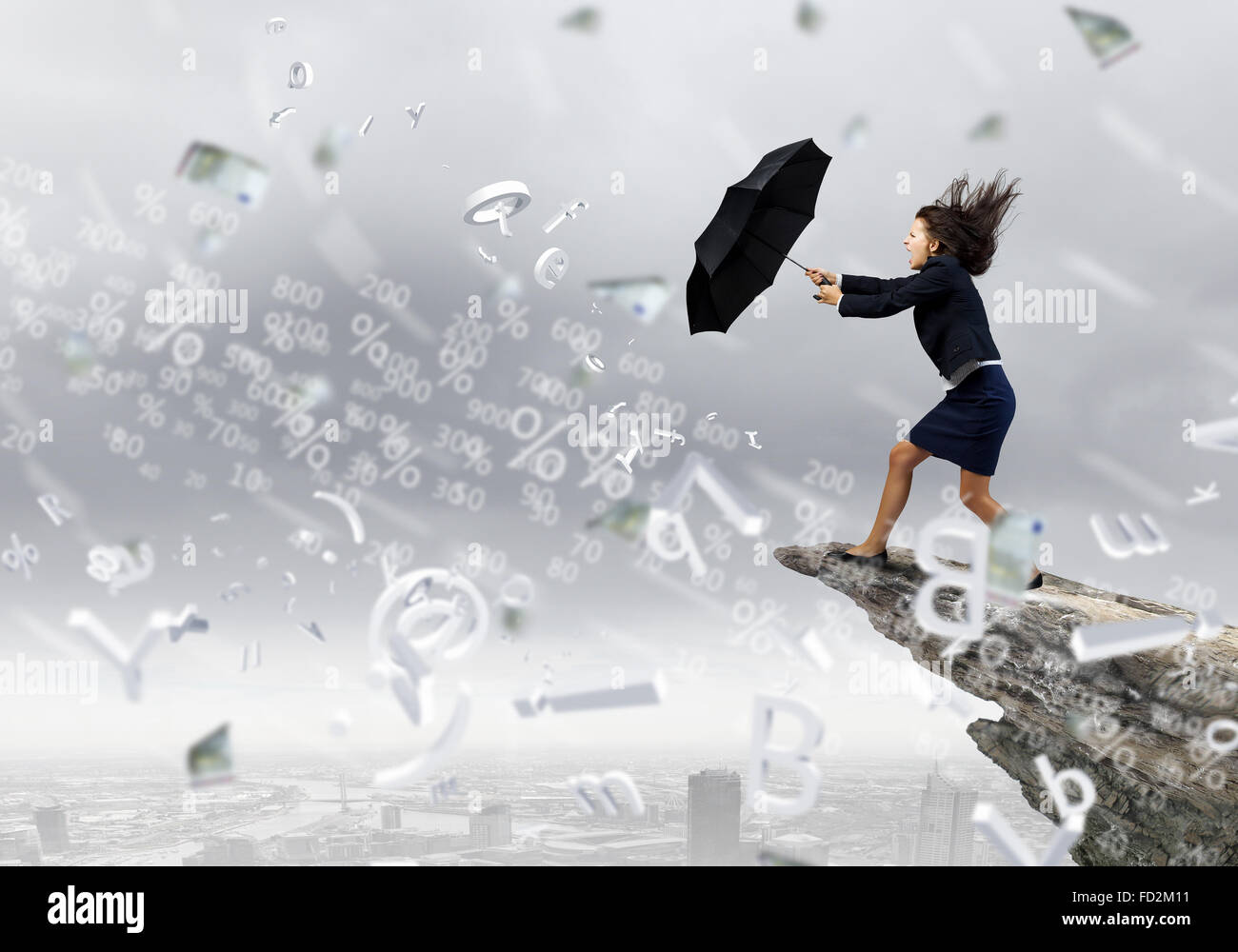 Person holding umbrella against wind hi-res stock photography and ...