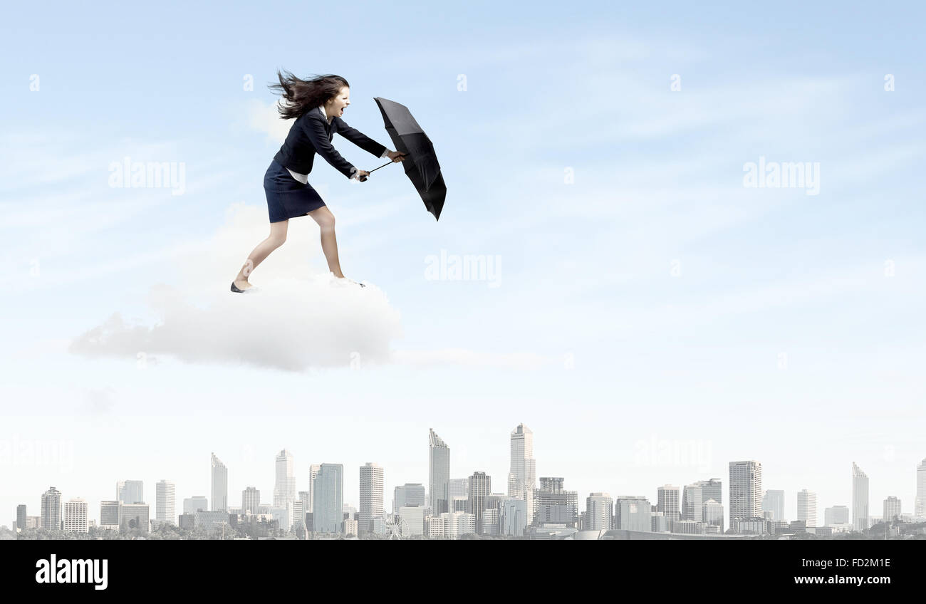 Person holding umbrella against wind hi-res stock photography and ...