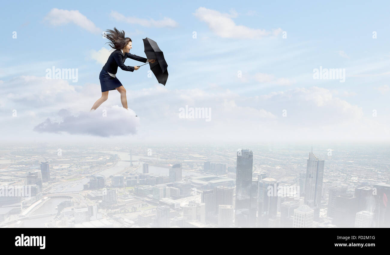 Person holding umbrella against wind hi-res stock photography and ...