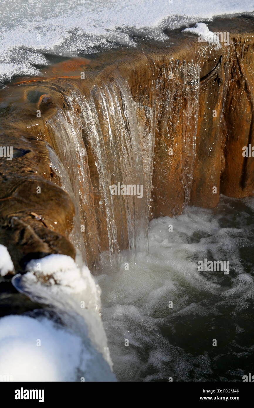 Beautiful little winter creek waterfall photographed closeup on a ...