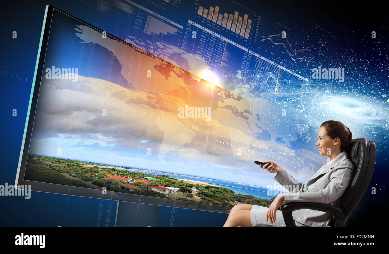 Young businesswoman in chair near tv screen with click Stock Photo - Alamy