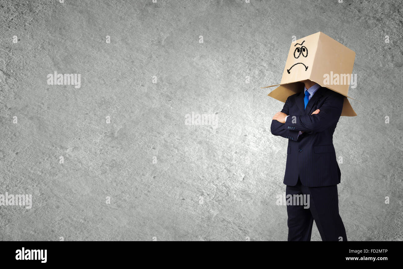 Unrecognizable businessman in suit wearing carton box on head Stock ...