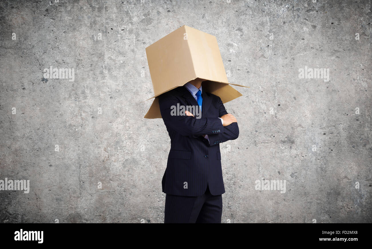 Unrecognizable businessman in suit wearing carton box on head Stock ...