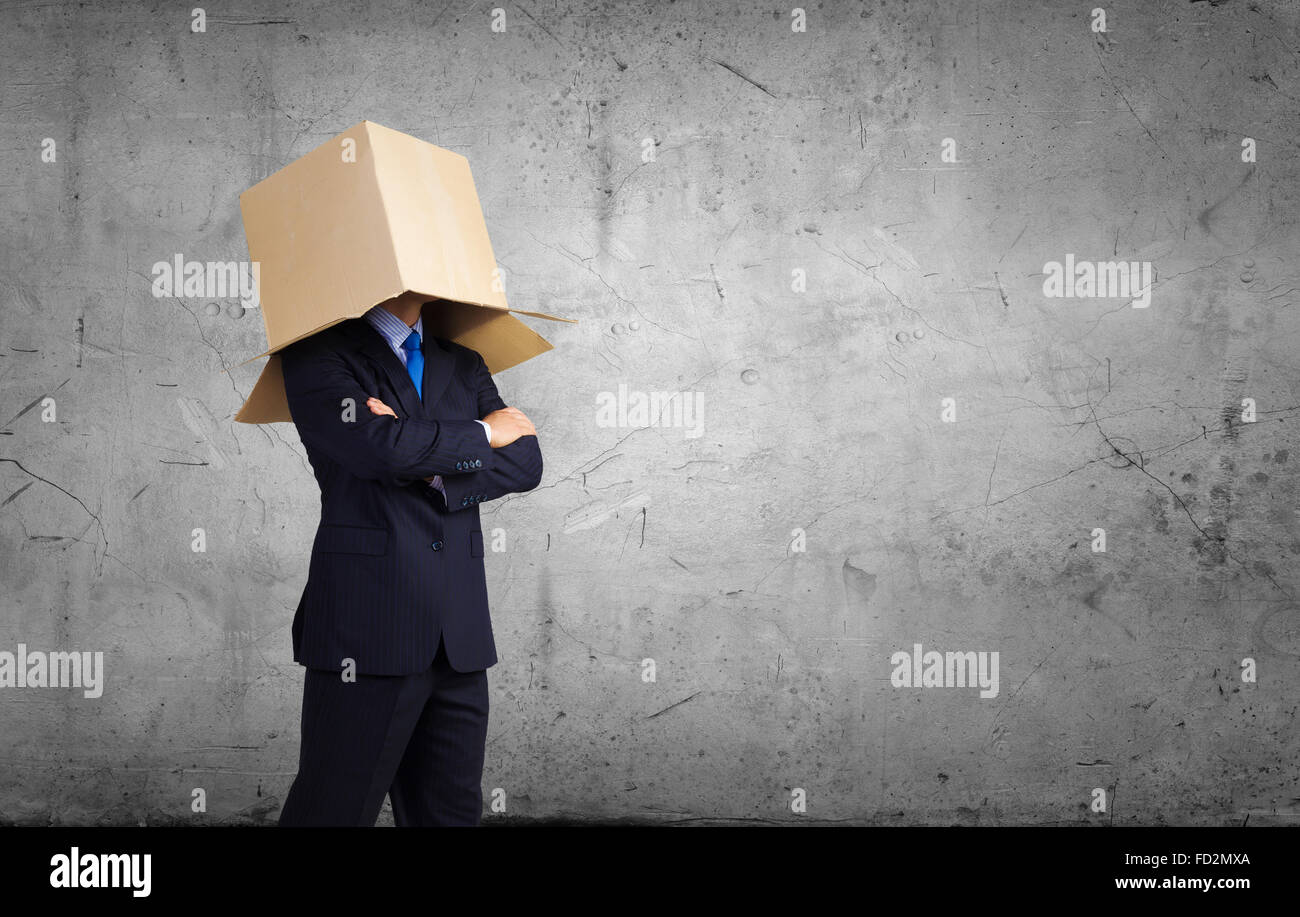 Unrecognizable businessman in suit wearing carton box on head Stock ...