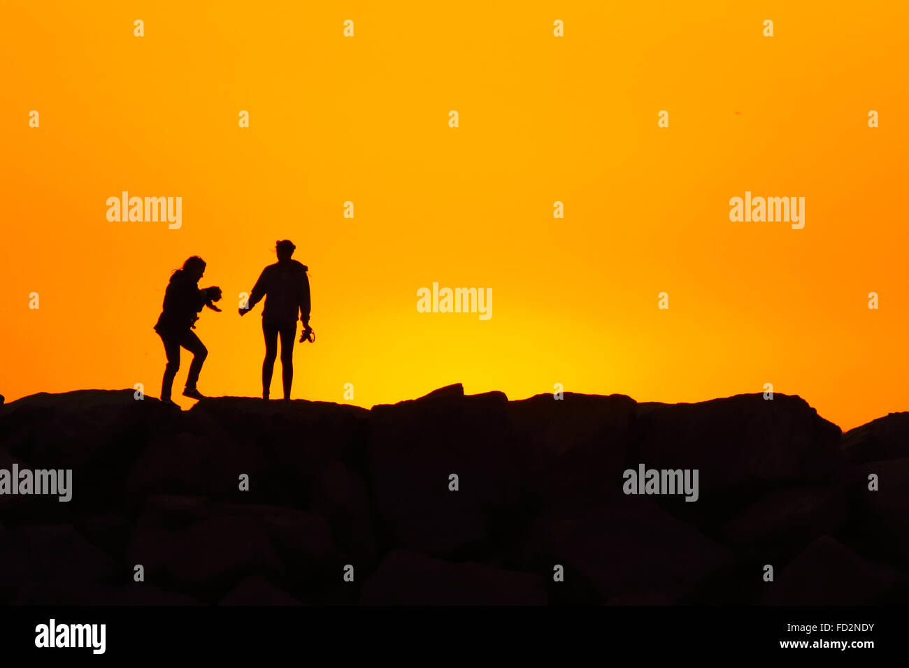 Helping offering help hi-res stock photography and images - Alamy