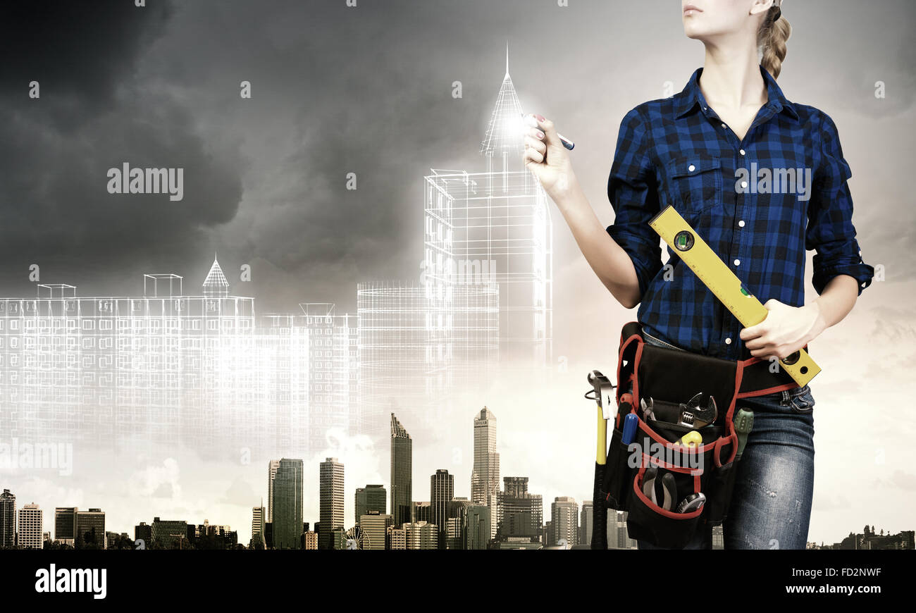 Close up of woman builder with ruler in hands Stock Photo - Alamy