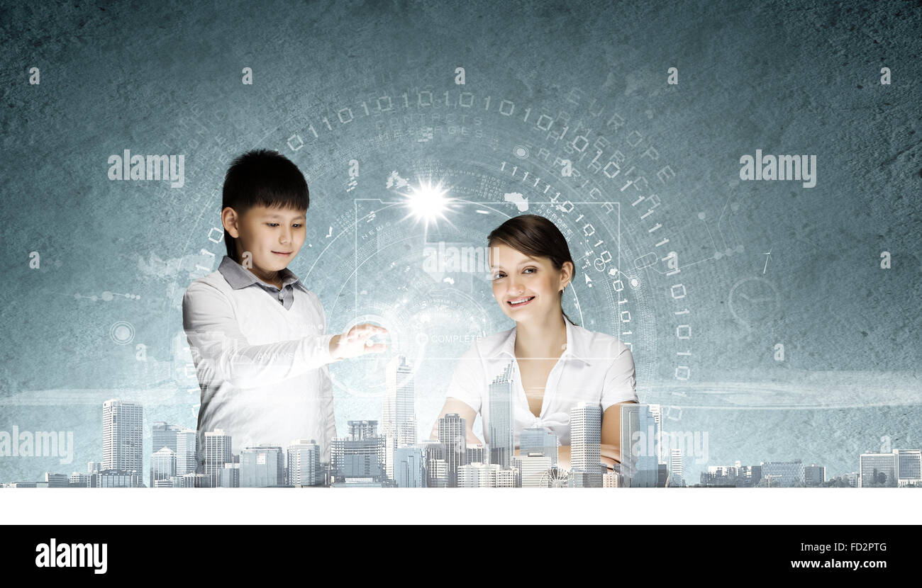 Young teacher and school boy at computing lesson Stock Photo - Alamy