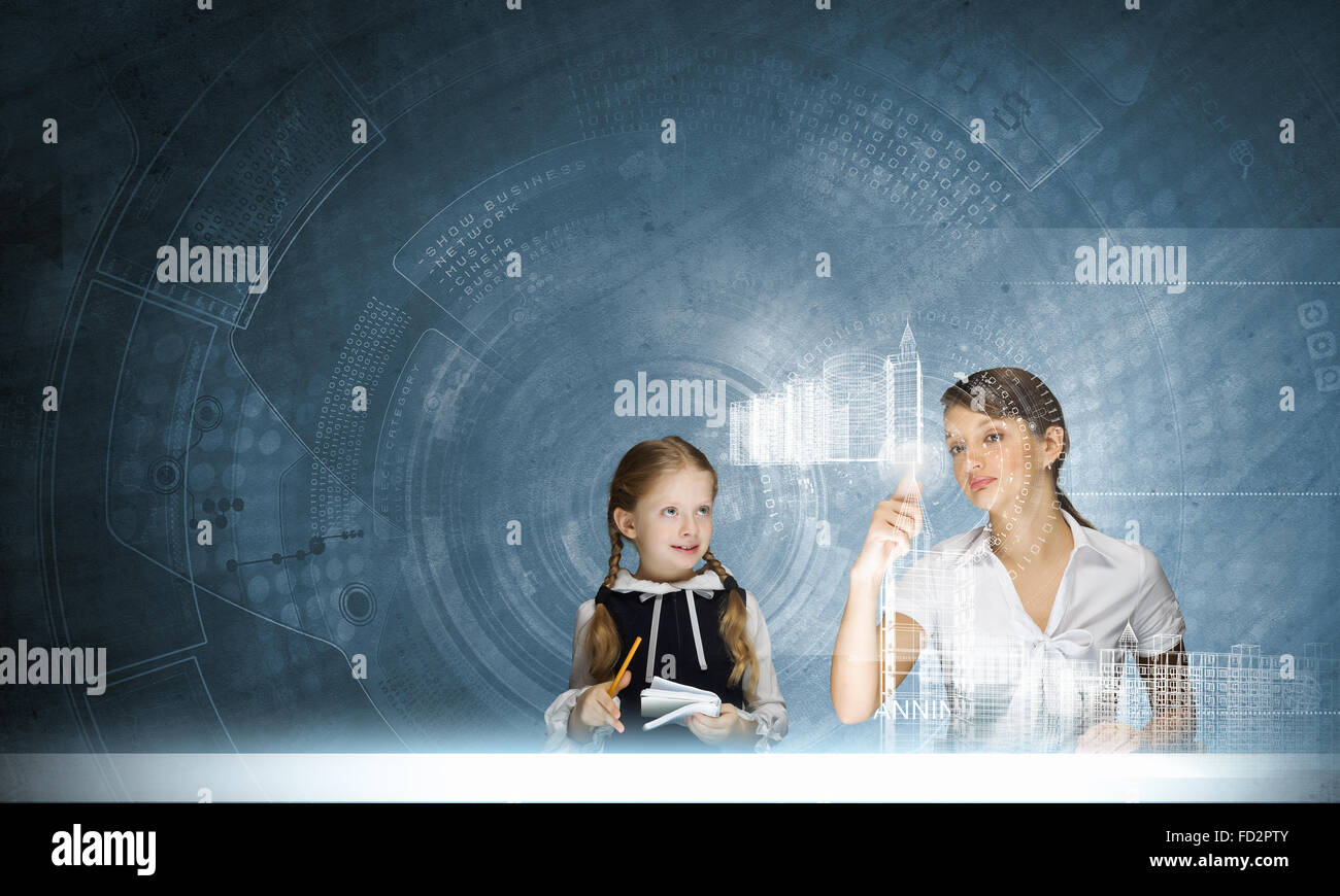 Young teacher and school girl at computing lesson Stock Photo - Alamy