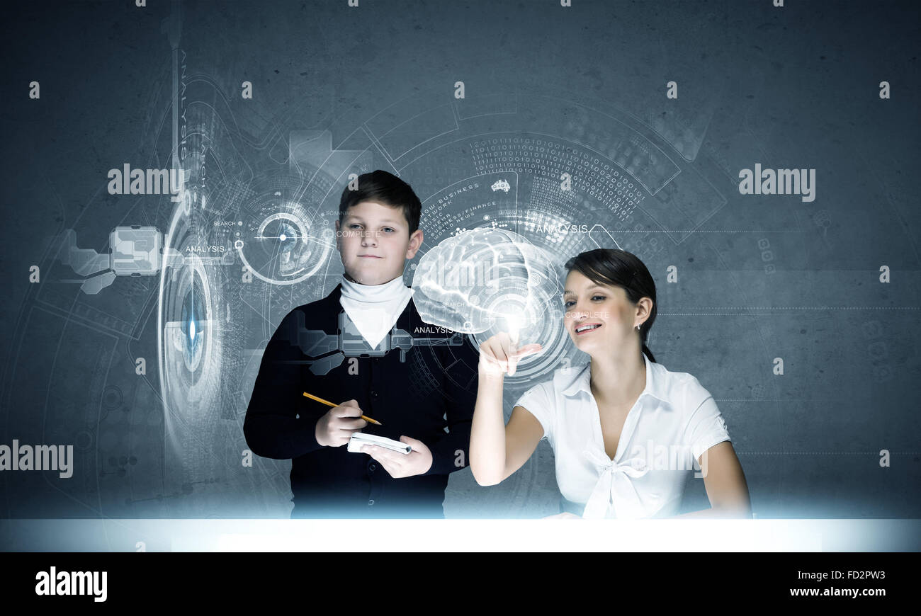 Young teacher and school boy at computing lesson Stock Photo - Alamy