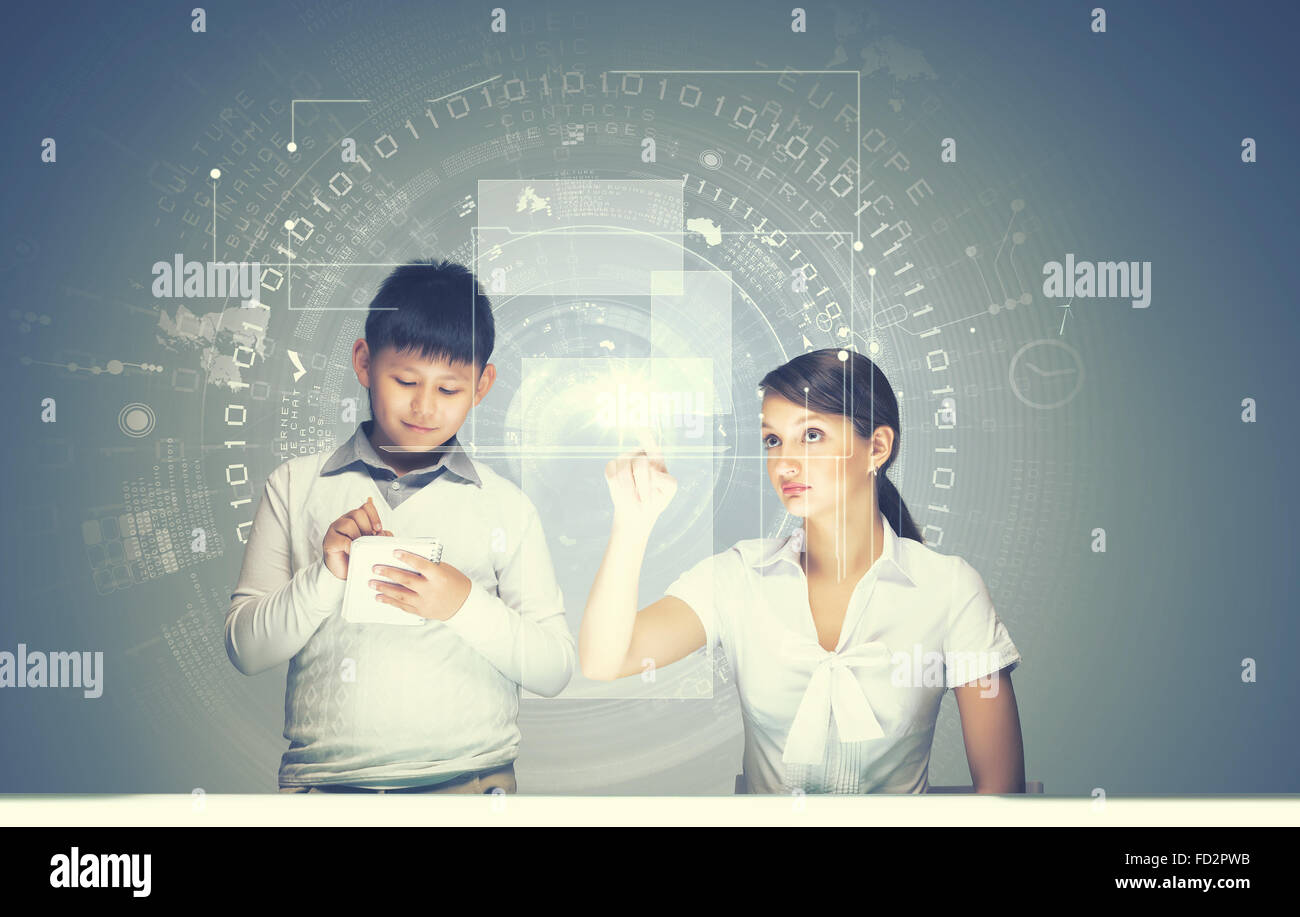 Young teacher and school boy at computing lesson Stock Photo - Alamy