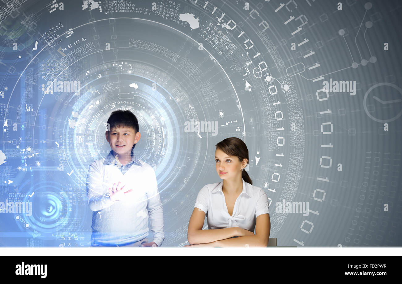 Young teacher and school boy at computing lesson Stock Photo - Alamy