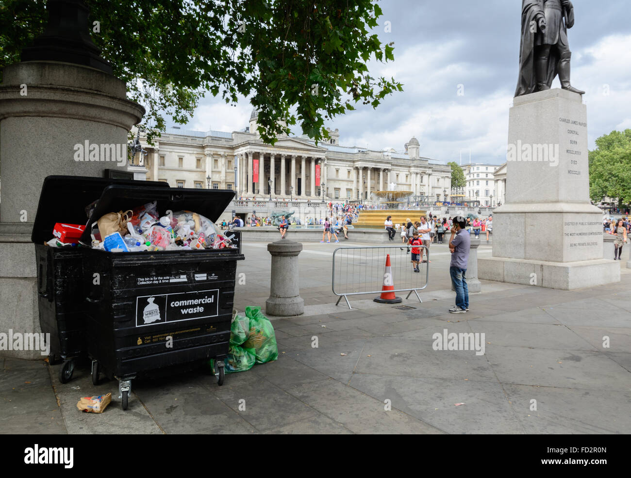 Overflowing commercial waste container full with garbage on Trafalgar ...