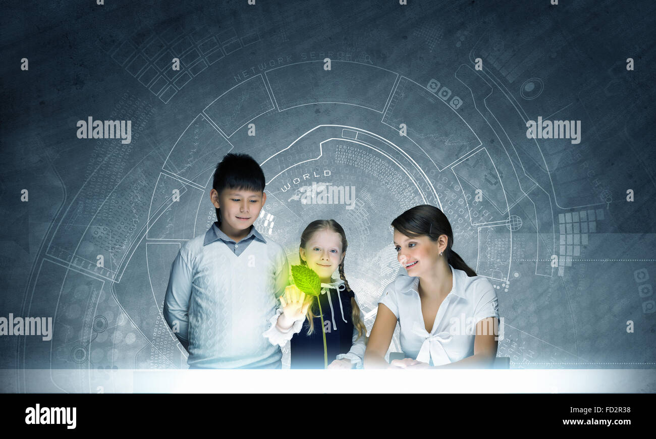 Young teacher and school children at botany lesson Stock Photo - Alamy