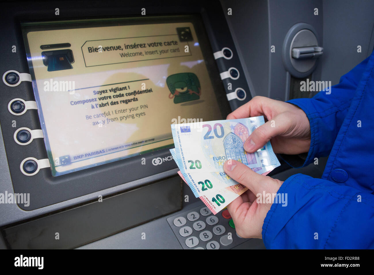 Cash dispenser person hi-res stock photography and images - Alamy