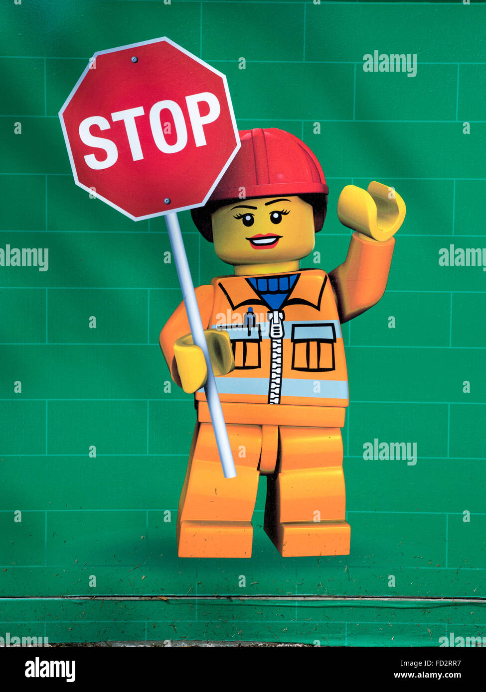 A Lego Poster With A Female Construction Worker Holding A Stop Sign ...