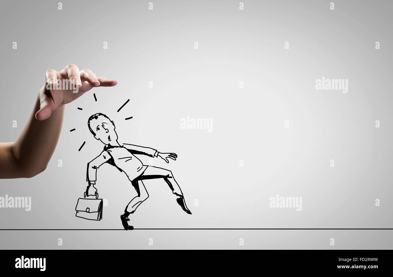 Close up of human hand catching running away businessman Stock Photo ...