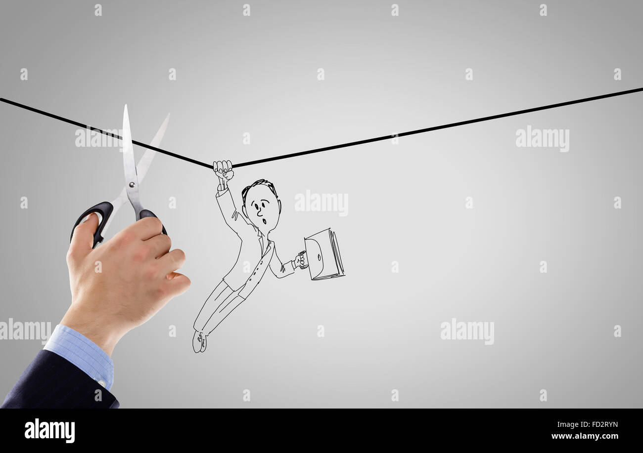 Close up of hand cutting rope with scissors Stock Photo - Alamy