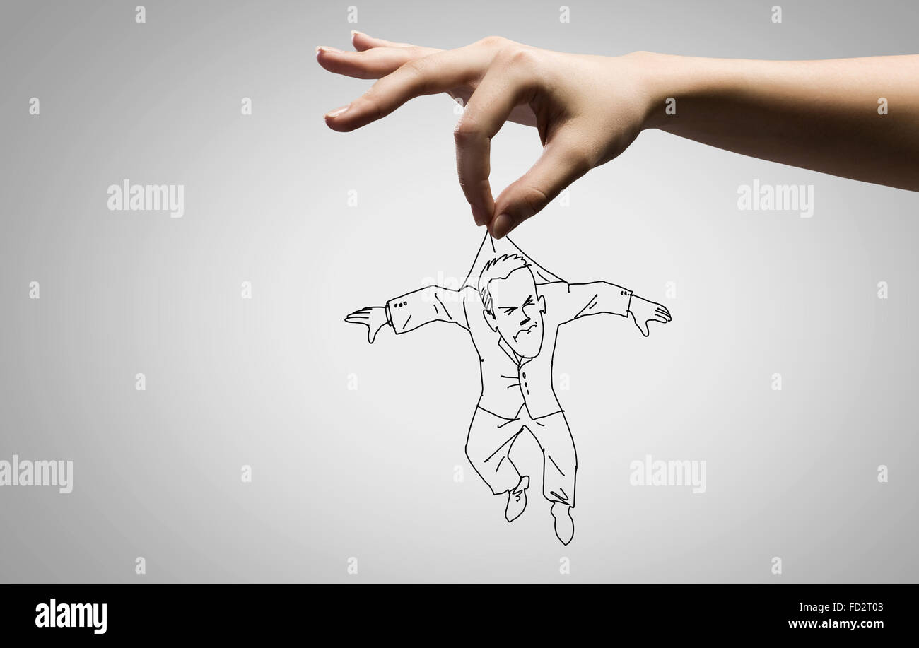 Close up of human hand catching running away businessman Stock Photo ...