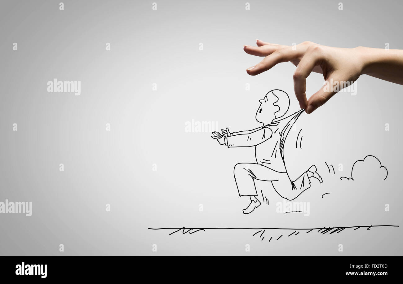 Close up of human hand catching running away businessman Stock Photo ...