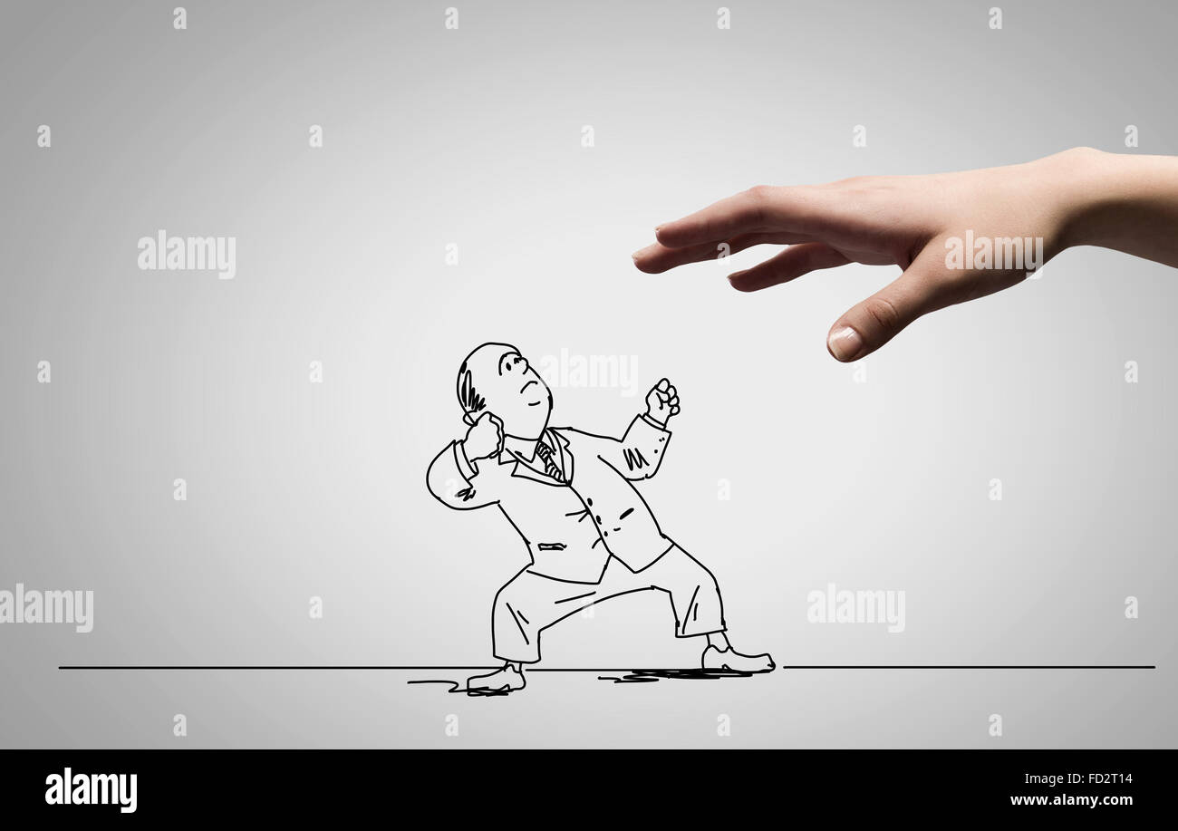 Close up of human hand catching running away businessman Stock Photo ...