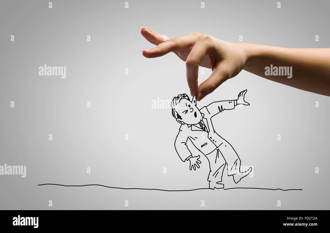 Close up of human hand catching running away businessman Stock Photo ...