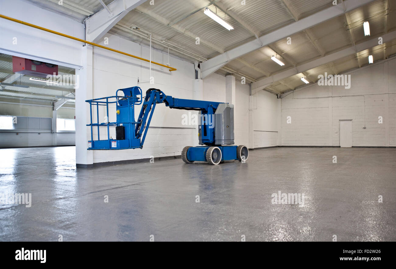 Industrial elevated crane platform in empty warehouse Stock Photo - Alamy