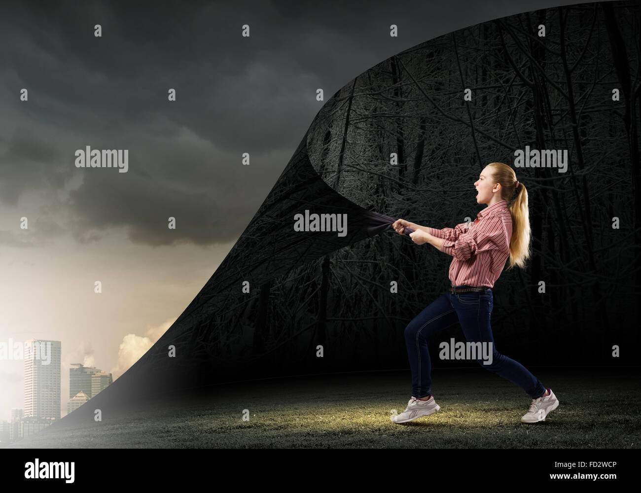 Young woman pulling page to change scene Stock Photo - Alamy
