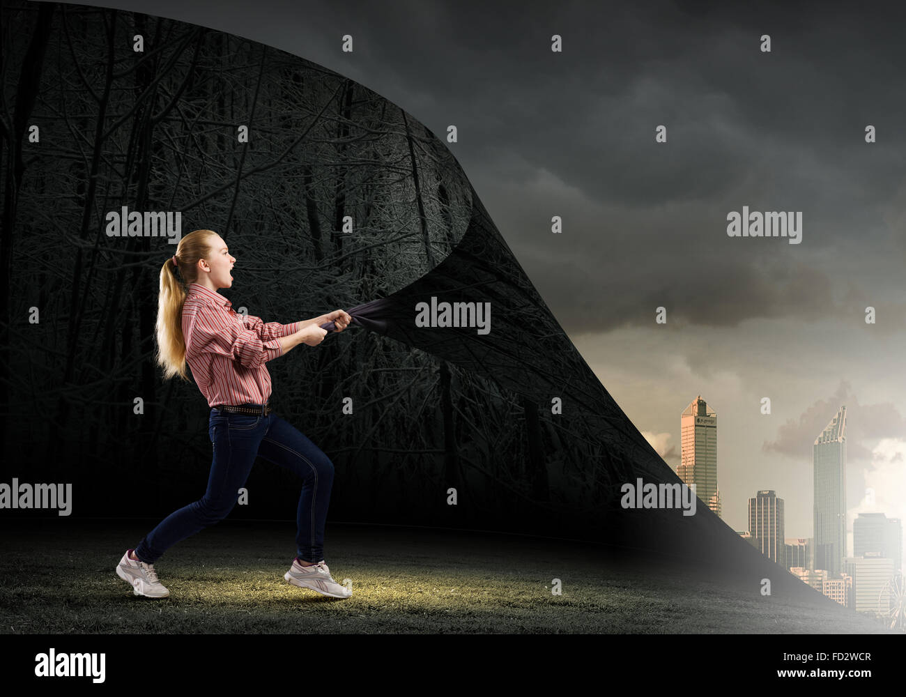 Young woman pulling page to change scene Stock Photo - Alamy