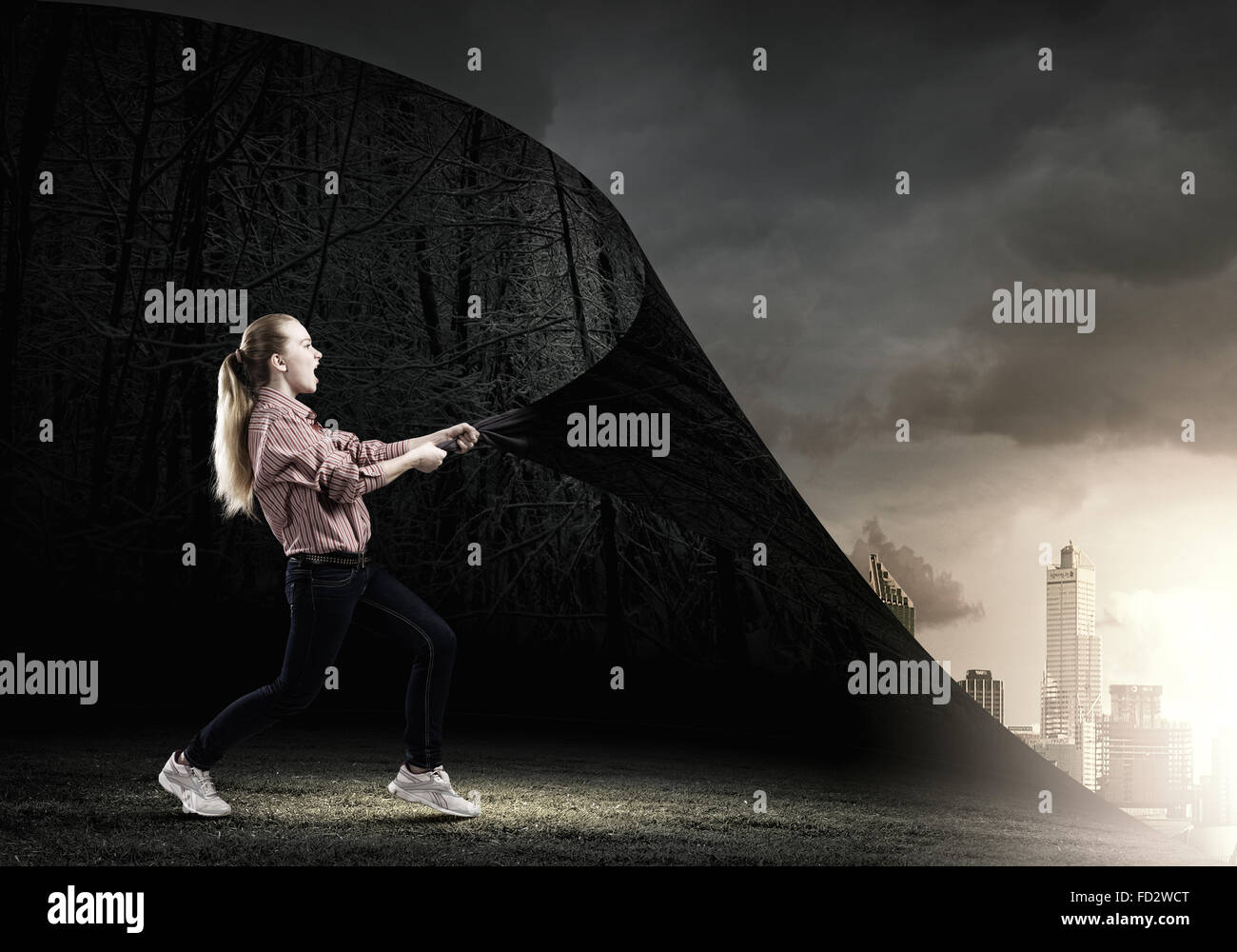 Young woman pulling page to change scene Stock Photo - Alamy