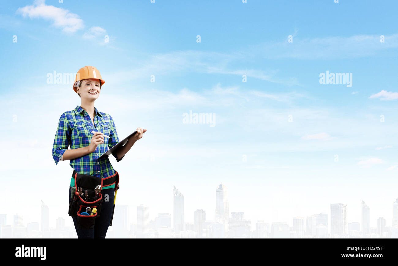 Young woman builder with projects in hand Stock Photo - Alamy
