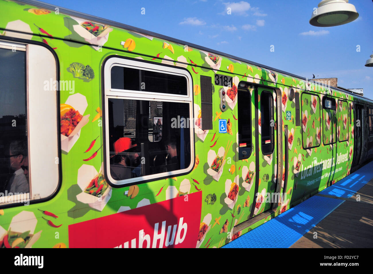 A CTA Blue Line rapid transit train sporting colorful advertising pulls ...