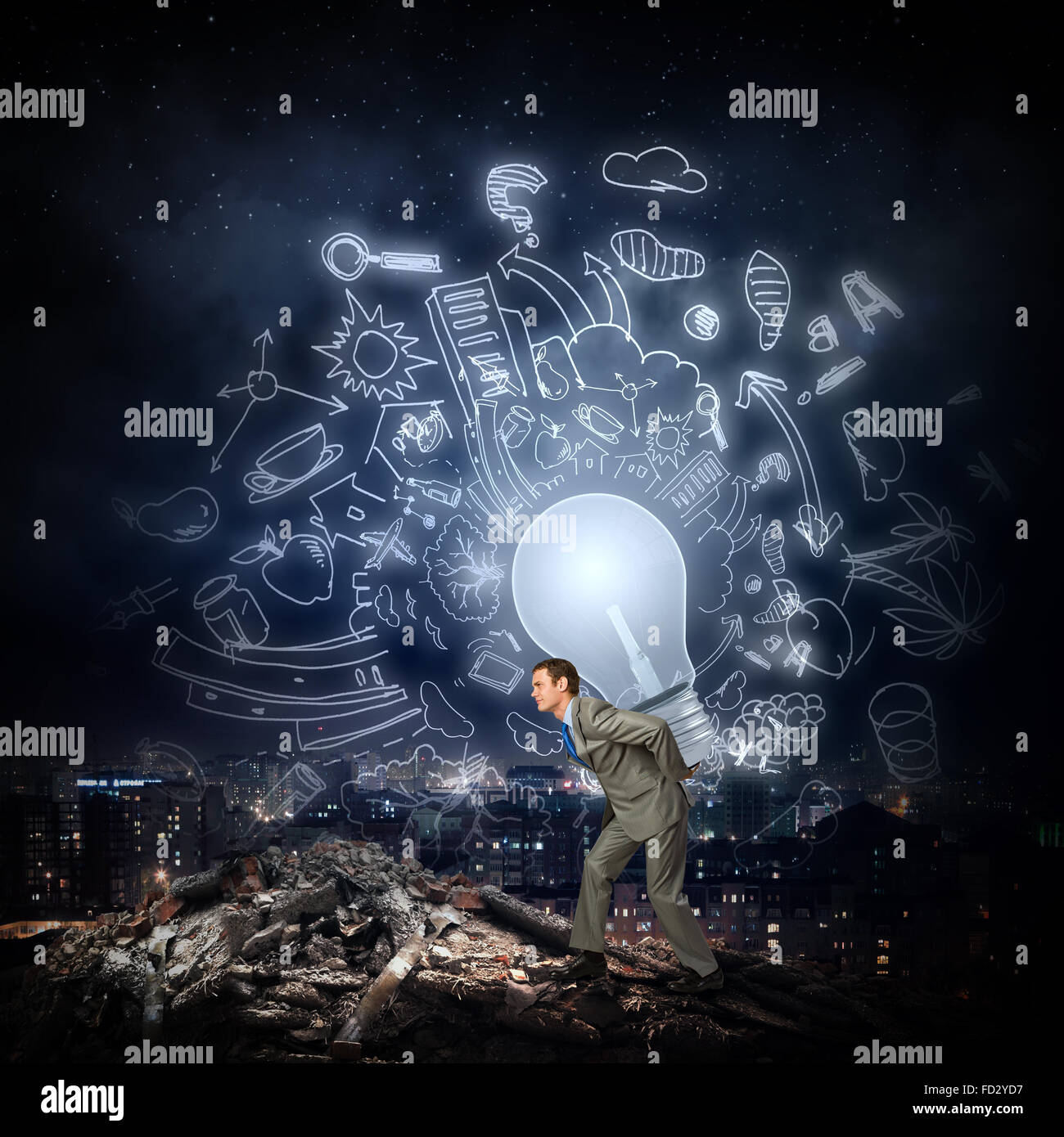 Young businessman carrying light bulb on back Stock Photo - Alamy