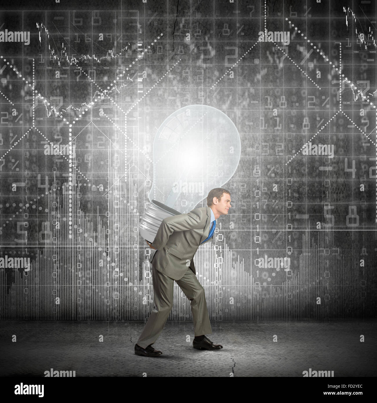 Young businessman carrying light bulb on back Stock Photo - Alamy