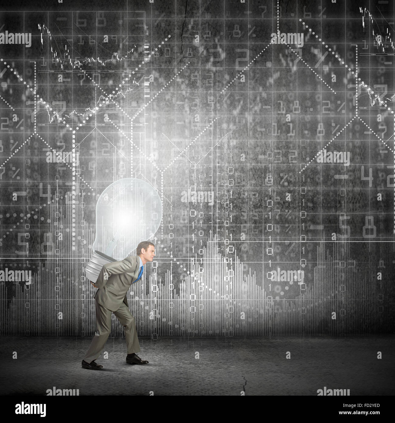 Young businessman carrying light bulb on back Stock Photo - Alamy