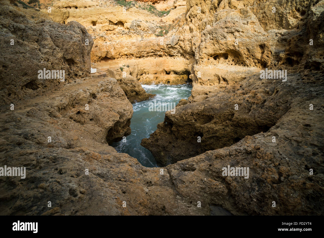 Large rock pool at Algar Seco, near Carvoeiro in the Algarve region of ...