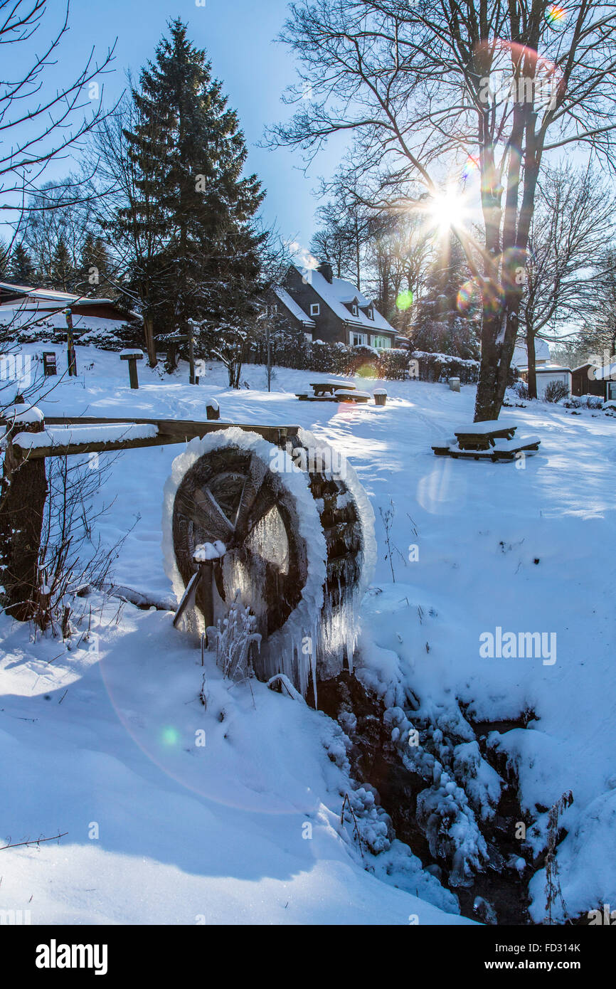 Wooden water wheel, frozen, ice sculptures, icicles along the wheel ...