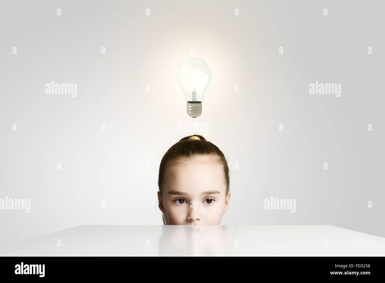 Little cute school girl and electric bulb Stock Photo - Alamy
