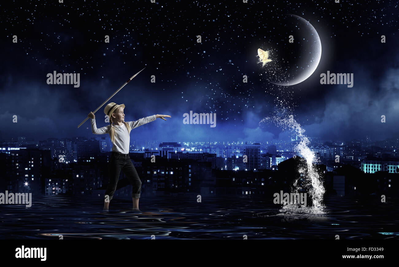 Cute girl fisherman throwing harpoon to catch gold fish Stock Photo - Alamy