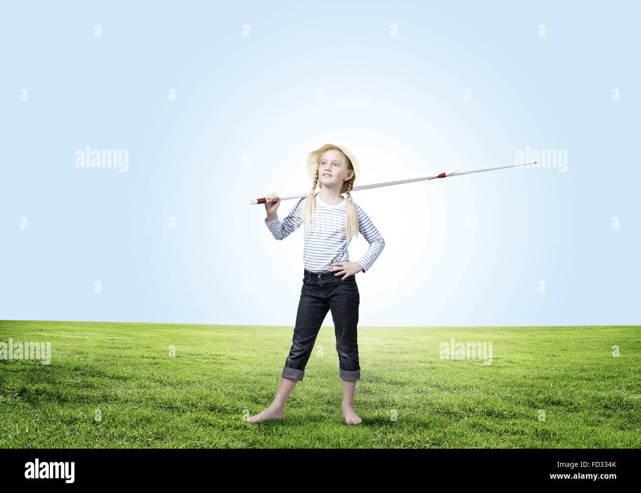 Cute girl with fishing rod on shoulder Stock Photo - Alamy
