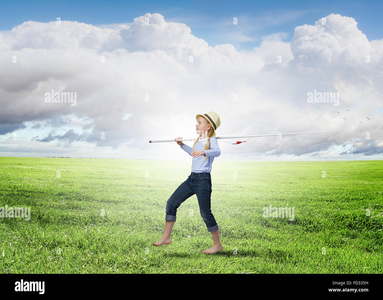 Cute girl with fishing rod on shoulder Stock Photo - Alamy